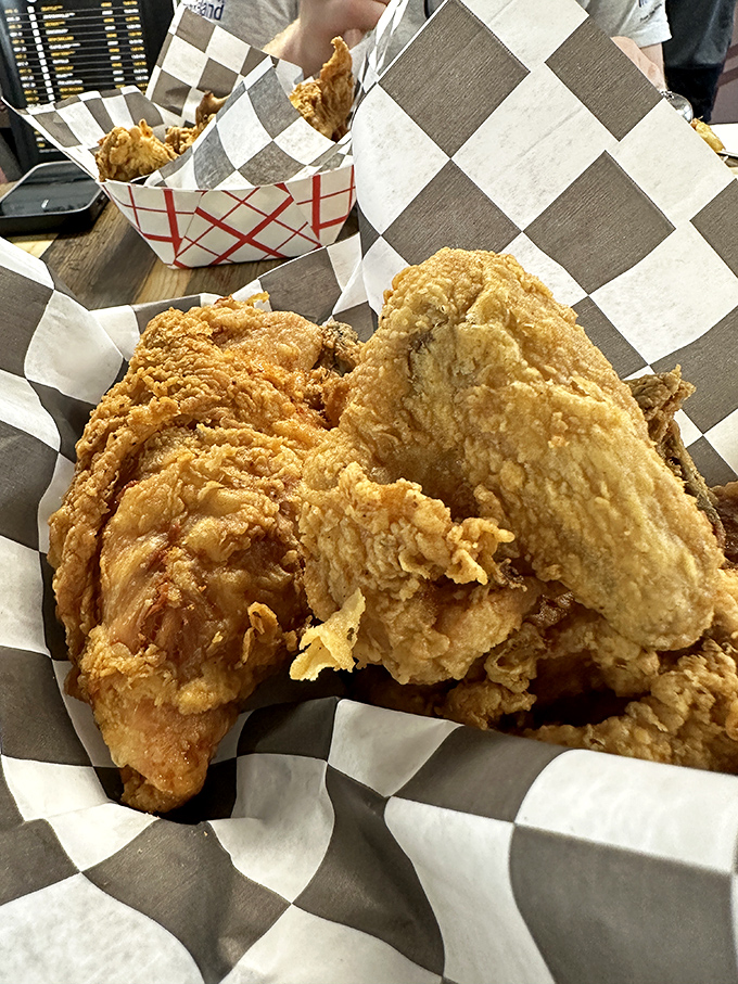 Served in unpretentious checkered paper, this chicken doesn't need fancy presentation. When you're royalty, you don't need the crown. 