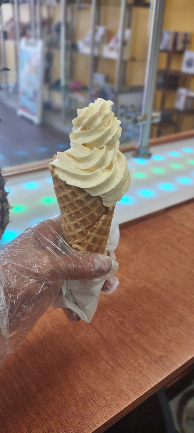 Vanilla ice cream with the dignified posture of a British royal. The waffle cone stands at attention, ready to serve its creamy commander.