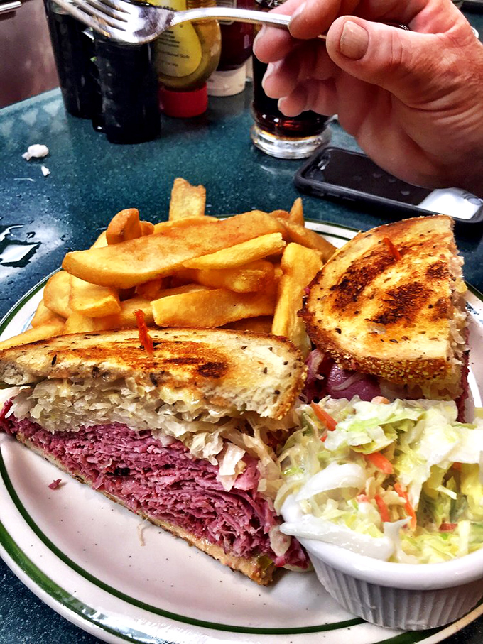 Layer upon layer of perfectly sliced meat, the sauerkraut adding that essential tang. This sandwich doesn't just satisfy hunger&mdash;it creates memories.