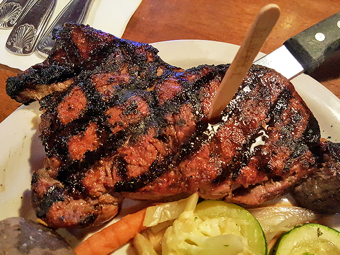 The bar area&mdash;where sports fans become food fans and strangers become friends. Wood paneling and neon signs create that perfect "everybody knows your name" atmosphere.