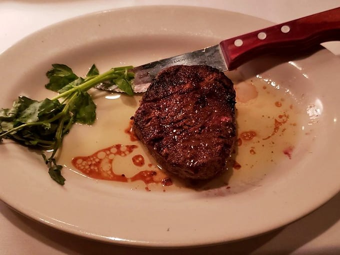 A filet that could make vegetarians question their life choices. That crust! That tenderness! That simple sprig of greenery for moral support!