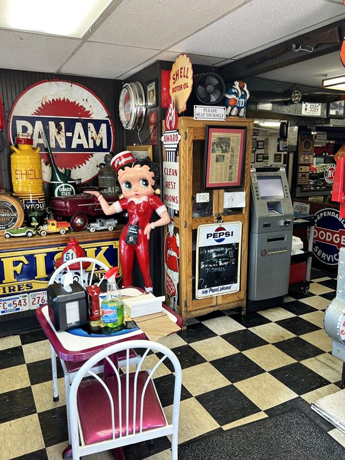 Betty Boop watches over diners like a sassy guardian angel of comfort food, surrounded by vintage signs that tell America's roadside story.