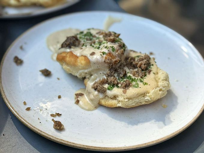 These biscuits aren't just covered in gravy&mdash;they're embraced by it. A comfort food hug on a plate, with herbs adding that perfect finishing touch.