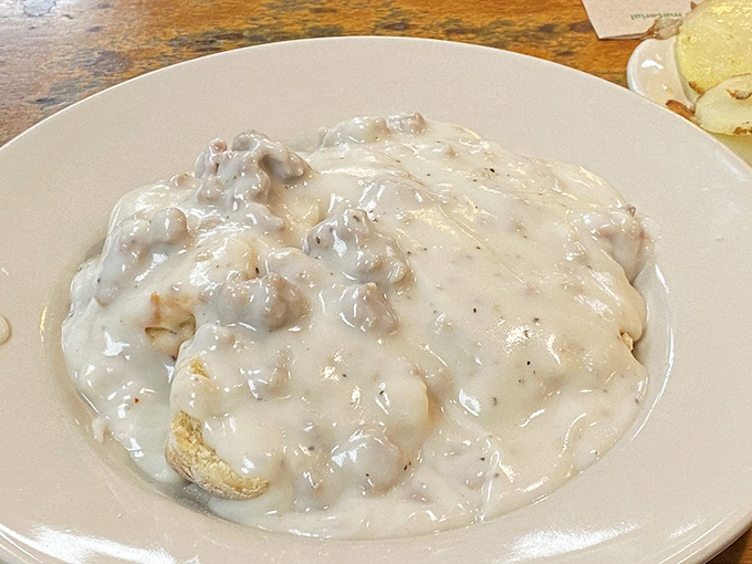 Biscuits and gravy: The breakfast that hugs you from the inside. This plate contains more comfort than a therapy session.