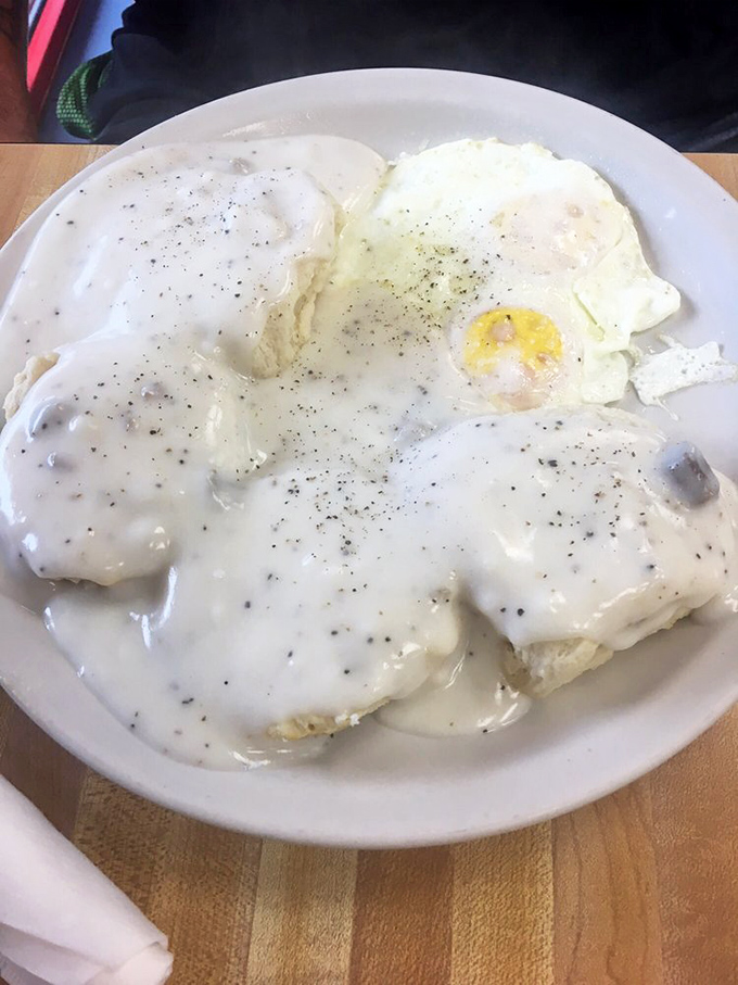 Biscuits swimming in creamy gravy with sunny-side eggs standing guard. Southern comfort doesn't get more literal&mdash;or delicious&mdash;than this.
