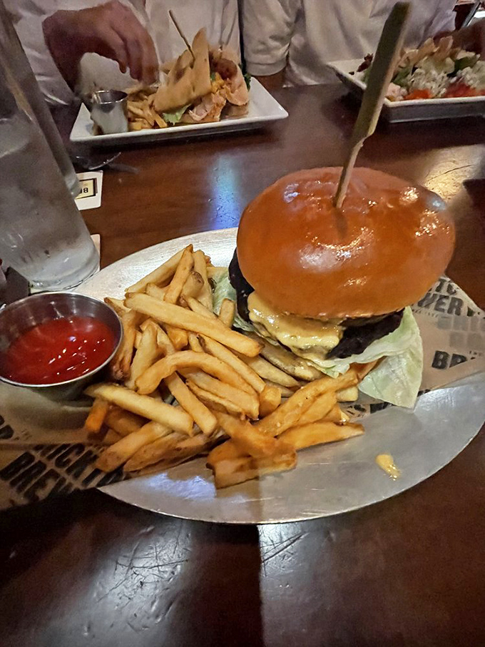 Behold the burger that launched a thousand satisfied sighs, where beef meets bun in a relationship so perfect it should have its own reality show.