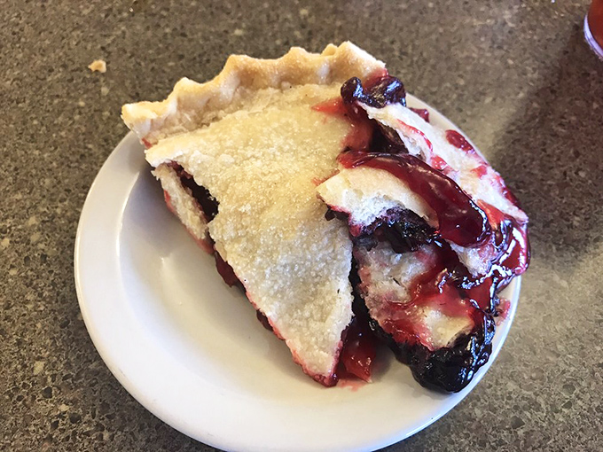 That moment when the berry filling peeks out from under the crust, whispering sweet promises that summer isn't really over.