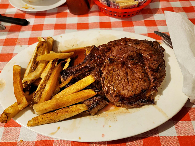 This bone-in ribeye with hand-cut fries isn't just dinner&mdash;it's a religious experience. Carnivores, prepare to meet your maker's masterpiece. 