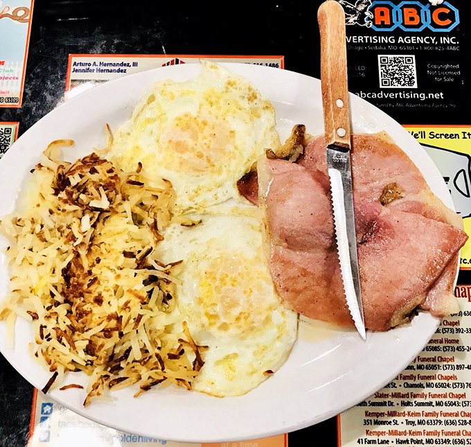 The kind of plate that silences conversation, replacing words with the universal language of contented breakfast noises.