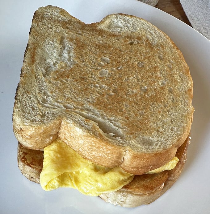 Breakfast sandwiches elsewhere are mere sustenance. Here, they're an egg-stuffed love letter to morning possibilities.