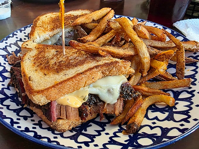 This brisket sandwich isn't just lunch&mdash;it's architectural genius with layers of smoke-kissed beef, melted cheese, and golden toast.
