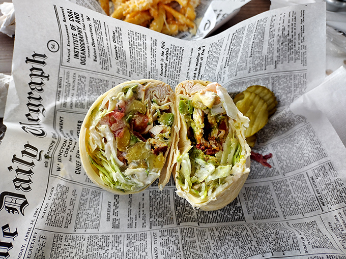 The humble wrap, elevated to art form. Wrapped in newspaper because some stories are too delicious not to share. 