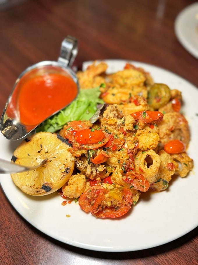Seafood that Frank Sinatra would approve of&mdash;golden calamari and shrimp with a sauce worth swiping with any bread within reach.