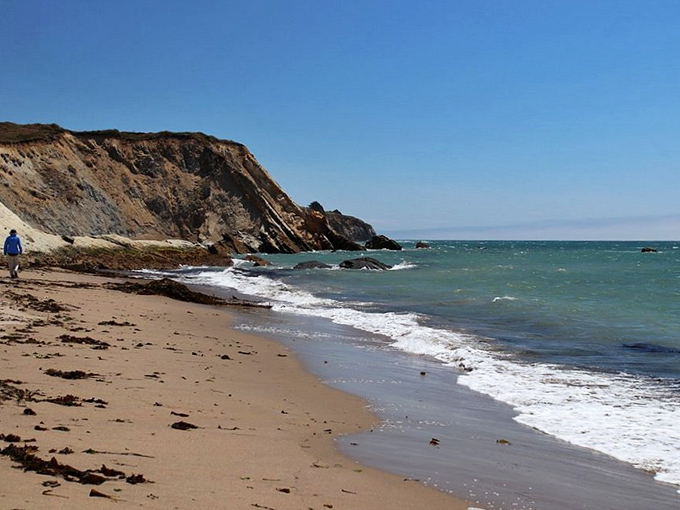 Layered sandstone tells Earth's autobiography one stripe at a time. These geological pages reveal millions of years of history in a single glance.