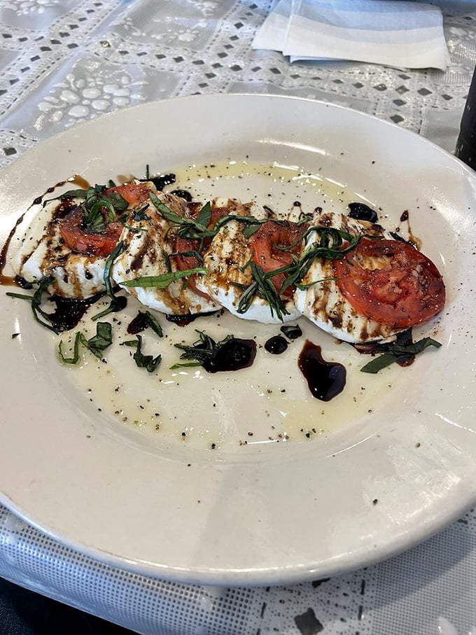 Fresh mozzarella, ripe tomatoes, and basil drizzled with balsamic&mdash;a caprese salad that tastes like summer in Italy, even in the middle of Kansas.