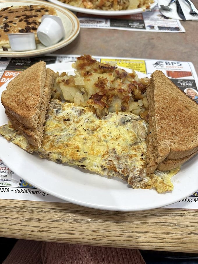 When a cheesesteak and an omelet fall in love, this is their beautiful offspring. Paired with home fries and toast, it's the breakfast of champions.