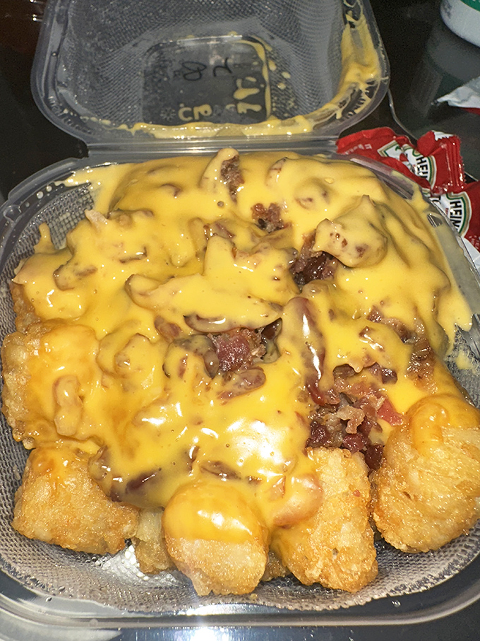 Cheese-covered tater tots with bacon&mdash;proof that sometimes the simplest pleasures are the most profound. Pure comfort in a container.