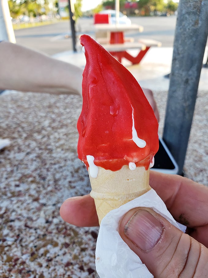Cherry-dipped soft serve brings back memories of summer carnivals and first dates. That vibrant red color practically screams "I'm not diet food!"