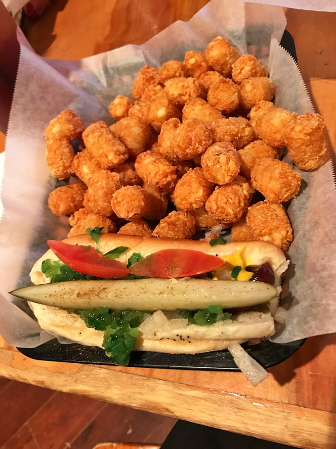 Chicago's famous poppy seed bun masterpiece alongside golden-brown tater tots &ndash; a duo more perfect than Batman and Robin, but much tastier.