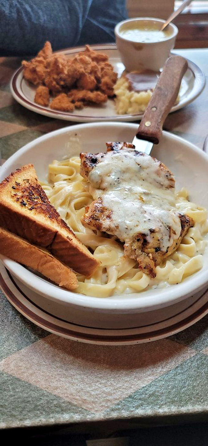 Chicken Alfredo that doesn't need a passport to impress. That melted cheese blanket isn't just topping&mdash;it's tucking those fettuccine noodles in for a flavor nap.