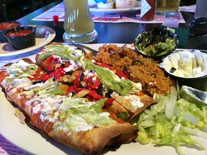 Not just an enchilada, but a colorful fiesta on a plate. The rice isn't playing a supporting role—it's demanding equal billing.