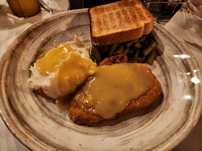 The chicken-fried steak and gravy answers the eternal question: "What if clouds were made of meat and could sit on mashed potatoes?"