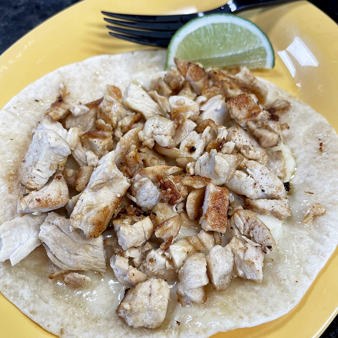 Simple yet sublime: tender chicken nestled in a golden-crisp tortilla pocket. The accompanying consommé turns each bite into a dippable adventure.