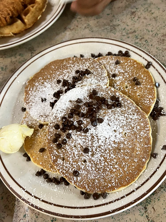 Chocolate chips nestled in fluffy pancakes with a dusting of powdered sugar&mdash;dessert masquerading as breakfast, and nobody's complaining.