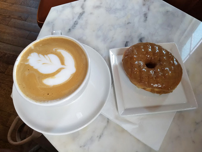 The perfect pairing doesn't exi&mdash; Oh wait, here it is: a meticulously crafted latte alongside a glazed donut that's calling your name. 