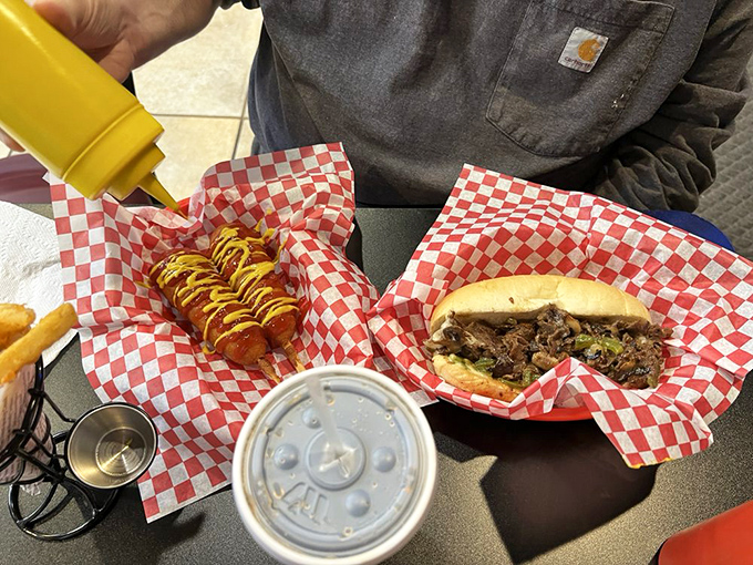 The perfect pairing&mdash;a mustard-drizzled corn dog alongside a classic Philly. Some relationships are just meant to be.