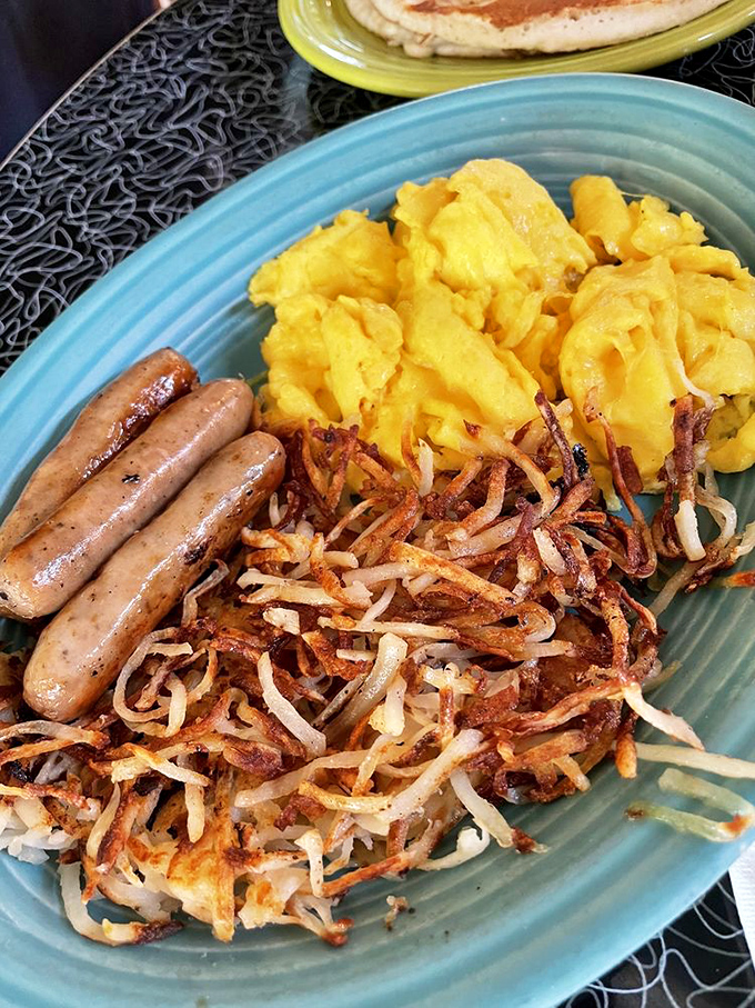Fluffy scrambled eggs, golden hash browns, and sausage links &ndash; the breakfast equivalent of winning the lottery three times in one morning.
