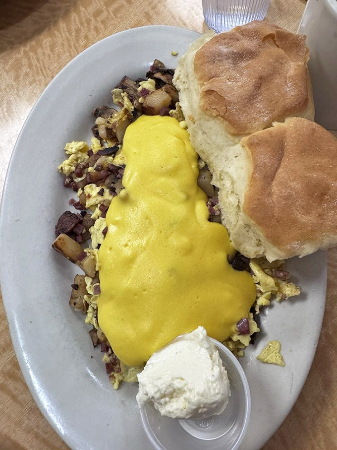 This breakfast plate doesn't just feed you&mdash;it hugs your soul. The potatoes are crispy in all the right places, like they attended finishing school for breakfast foods.