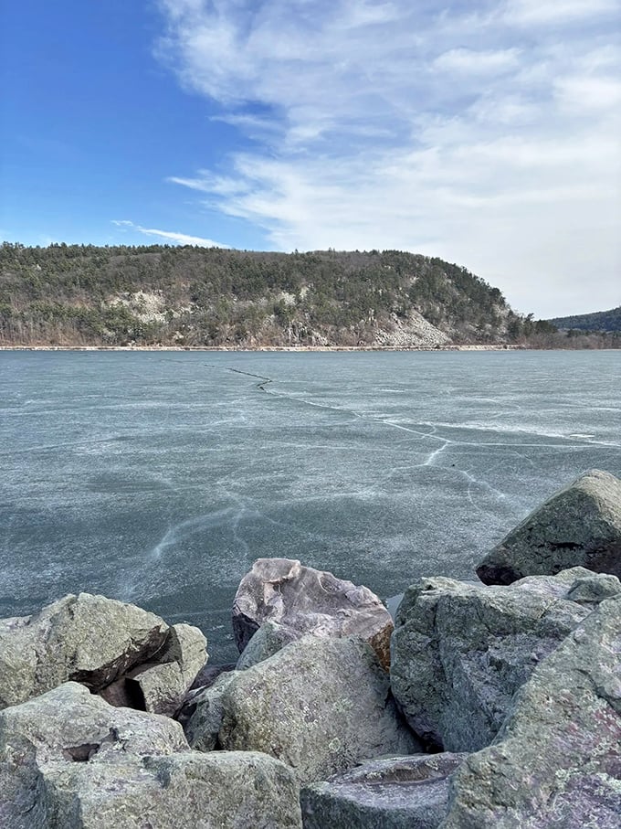 Winter transforms familiar landscapes into otherworldly wonderlands. Even the rocks seem to hibernate beneath their snowy blankets.
