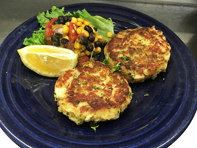 These crab cakes are the VIPs of the seafood world – more crab than cake, golden-brown and ready for their close-up with a side of bright, fresh corn salsa.