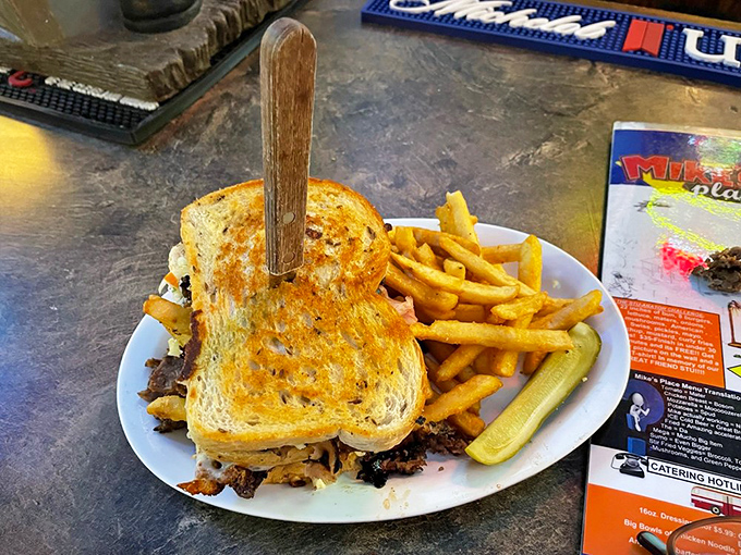 The sandwich stands tall and proud, like it just won a competition. Those golden fries and pickle spear aren't accessories&mdash;they're essential supporting characters.