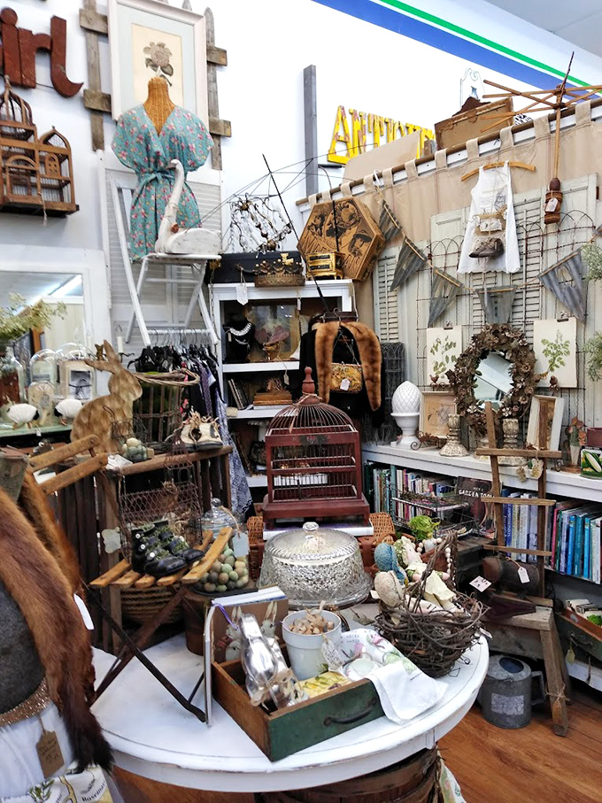 This isn't just a booth&mdash;it's a carefully curated corner of nostalgia where birdcages and vintage dresses create a dreamy vignette of yesteryear.