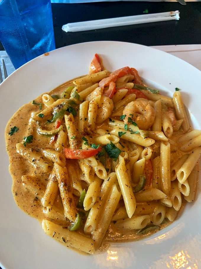 Penne swimming in creamy sauce with perfectly cooked shrimp and colorful vegetables&mdash;a plate that makes you want to write love poems to carbohydrates.