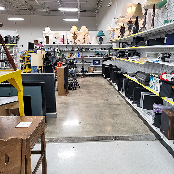 The electronics corner—where vintage lamps illuminate retired computer monitors, creating a tech museum that doubles as a bargain hunter's playground.