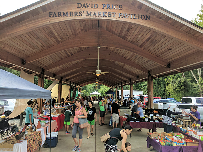 The David Price Farmers' Market Pavilion buzzes with weekend energy as locals hunt for the tomato that will make their sandwich legendary.