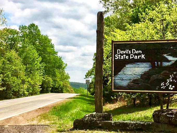 The entrance sign that promises more than it reveals&mdash;like finding the door to Narnia, but with better hiking trails and fewer talking lions.