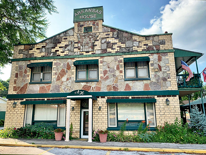 The Arkansas House stands proudly with its distinctive stone facade, like a geological timeline you can actually sleep in.