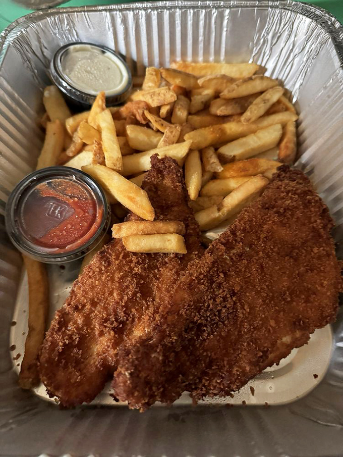Fish and chips that would make a British pub jealous, with a golden crust that crackles like a vinyl record of your favorite song.