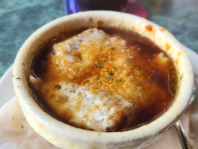 French onion soup so good it makes you forgive France for mimes. That melted cheese pull should have its own Instagram account. 