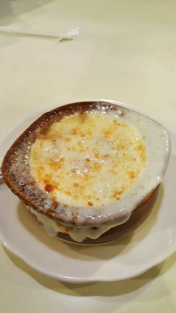 French onion soup with that perfect cheese pull that makes you want to start a slow-clap in the middle of the restaurant.