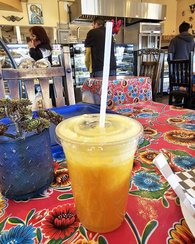 That fresh orange juice isn't just a beverage &ndash; it's liquid sunshine in a cup, sitting pretty on tablecloths that could outshine a rainbow.