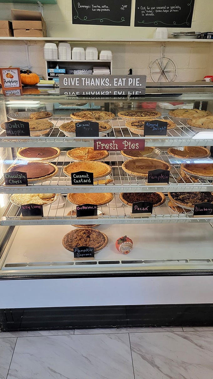 "Give Thanks. Eat Pie." The sign says it all, while the display case showcases a rainbow of pie possibilities from key lime to buttermilk.