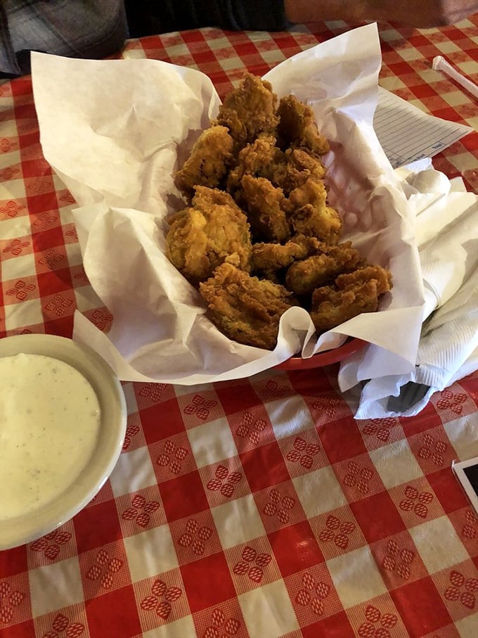 These golden-fried pickles nestled in paper deserve their own food group&mdash;tangy, crunchy miracles that vanish faster than your diet resolutions.