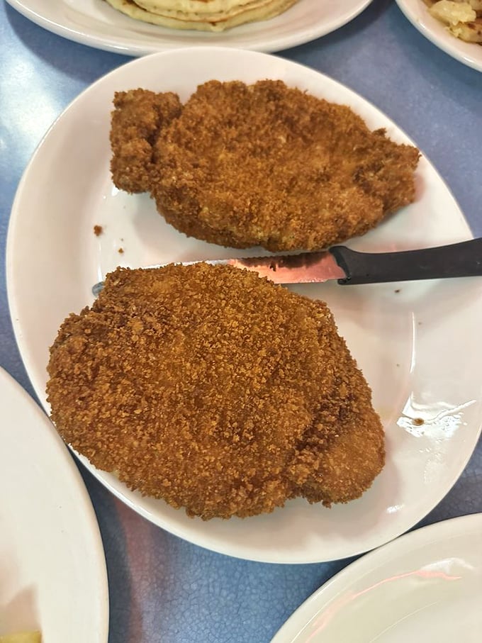 Breaded pork chops so golden they deserve their own trophy. Comfort food that reminds you of Sunday dinners at grandma's.