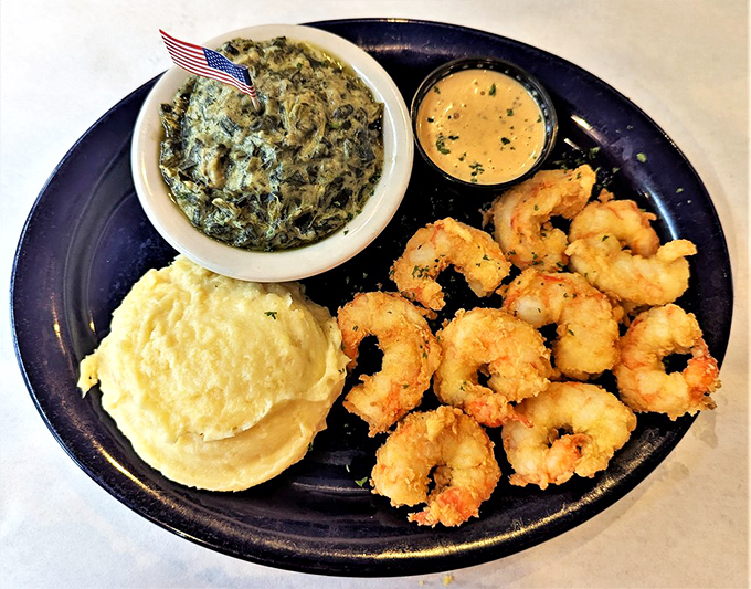 Southern hospitality meets coastal bounty in these perfectly fried shrimp. The creamy grits and collard greens complete this trifecta of Virginia goodness.
