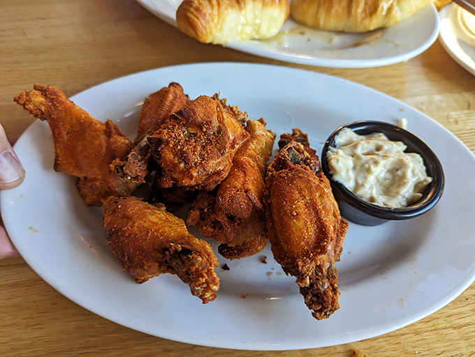 Fried chicken so perfectly golden it belongs in Fort Knox, with a crunch you can hear three tables away.